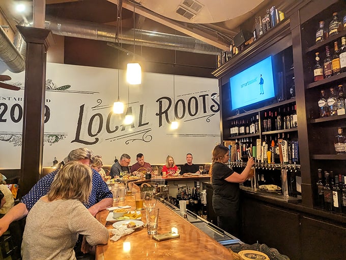 The bar at Local Roots isn't where you drown sorrows—it's where you celebrate finding a place that understands what drinking with good food means.