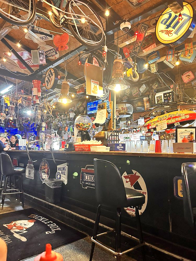 The bar area showcases decades of collected treasures. Is that a bicycle hanging from the ceiling? Of course it is! 