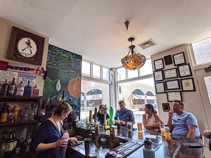 Where pints meet pies – this cozy bar corner offers liquid courage before you attempt to choose between all those tempting pastries.