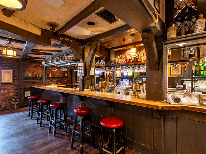 The bar is where time stands still—in the best possible way. Red stools invite you to sit and contemplate life's great mysteries, like which Scotch to try next.