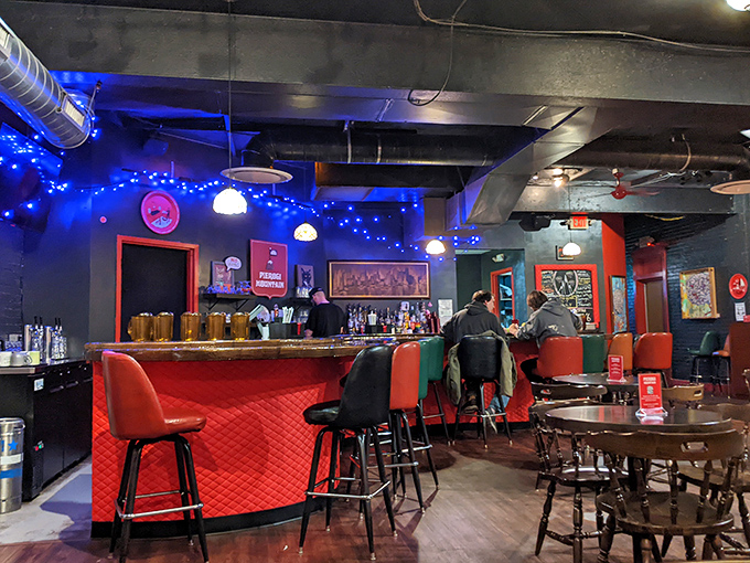 The red-quilted bar invites you to pull up a stool and stay awhile. Blue lights add a touch of modern flair to tradition.