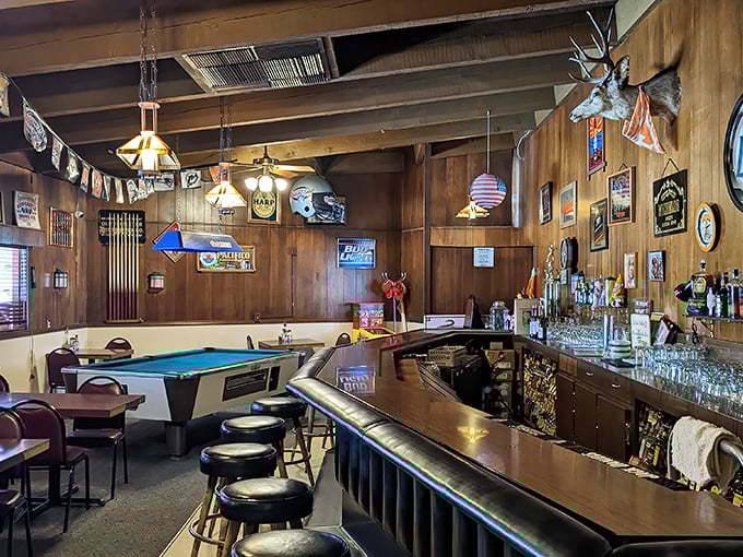 The bar area offers a different kind of mountain view—taxidermy and pool tables creating that authentic small-town watering hole experience.