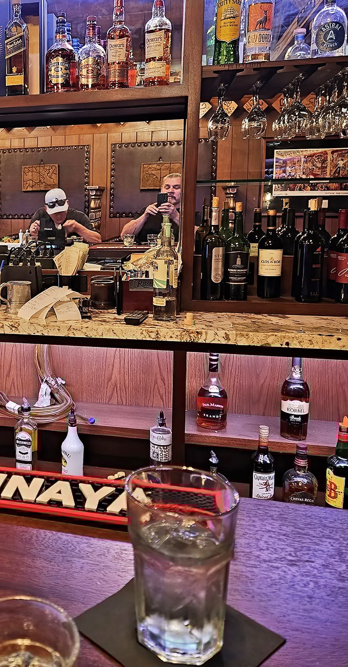 Behind the bar, liquid treasures await – from whiskey to wine, the well-stocked shelves promise the perfect pairing for your carnivorous adventure.