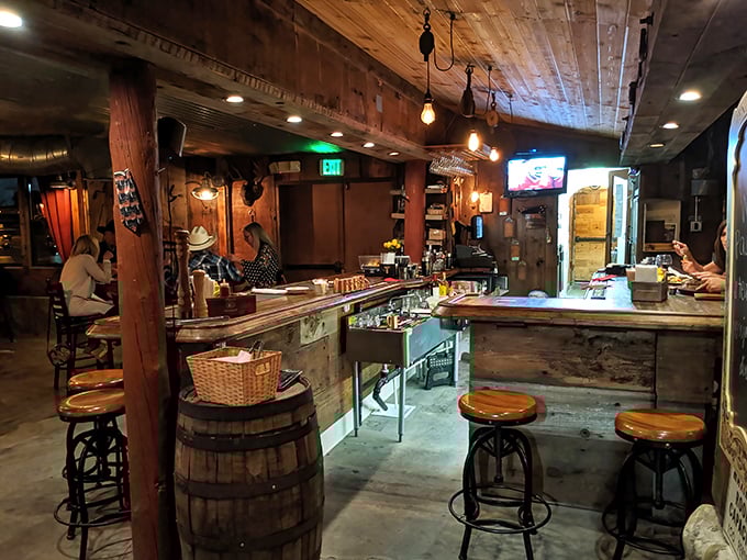 Barrel stools and weathered wood—this bar wasn't designed by committee but evolved naturally over decades of elbows, stories, and whiskey.