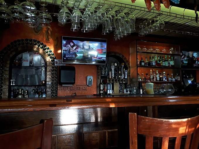 The bar isn't just serving drinks—it's crafting liquid happiness. Those hanging glasses are just waiting to be filled with something that'll make you forget Monday exists.