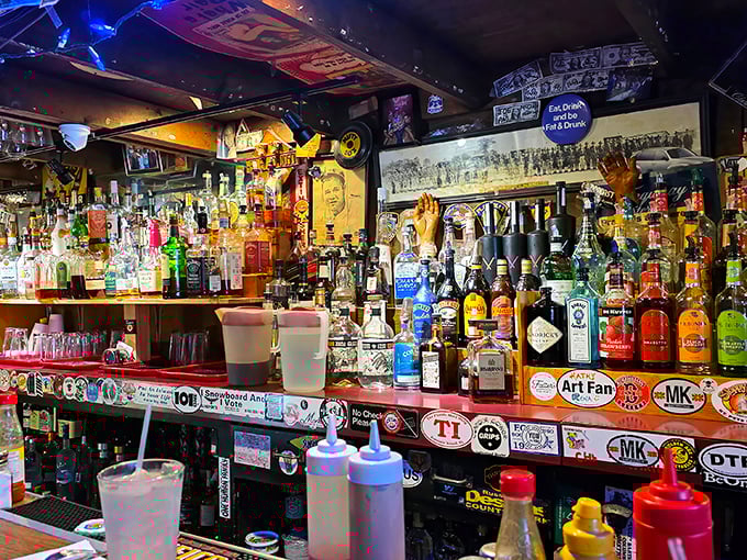 The bar showcases an impressive arsenal of spirits, each bottle standing ready to help wash down whatever mammoth creation you've ordered.