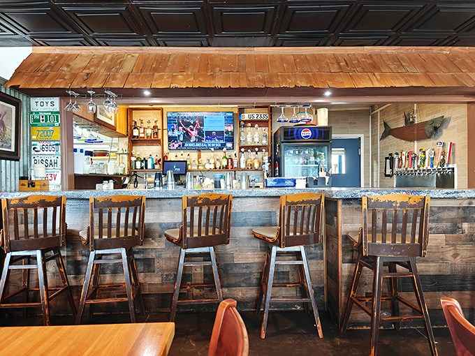 The bar area—where solo diners become regulars and regulars become family. Those wooden barstools have witnessed countless "first bite" expressions of pure joy.