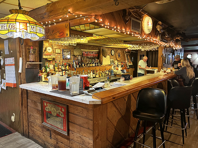 This isn't just a bar—it's a shrine to conviviality where string lights and Michelob signs create the perfect backdrop for life's celebrations.