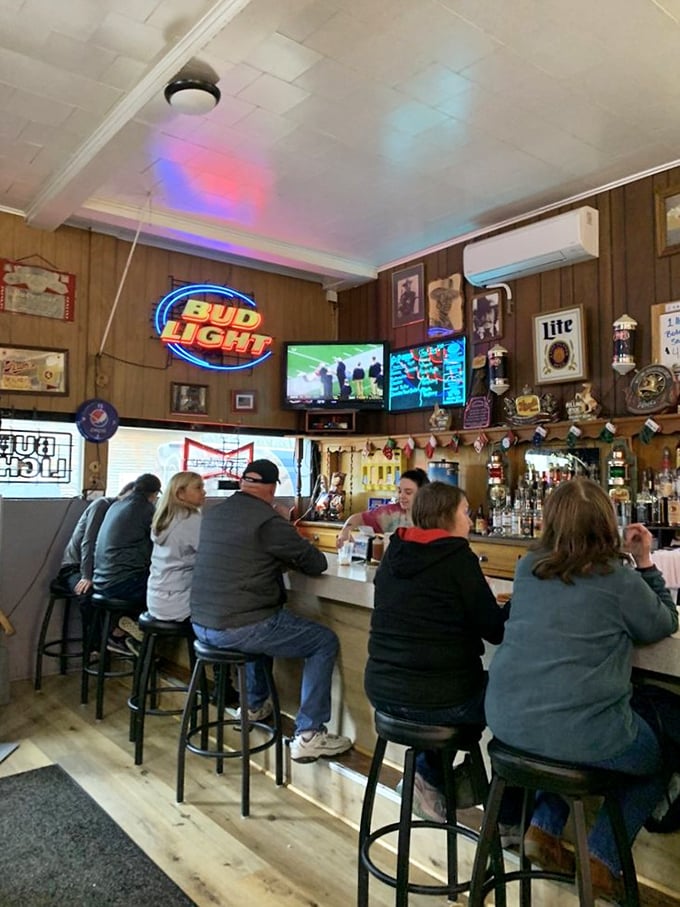 The bar area buzzes with conversation and neon signs—a Midwestern tavern in its most authentic form.