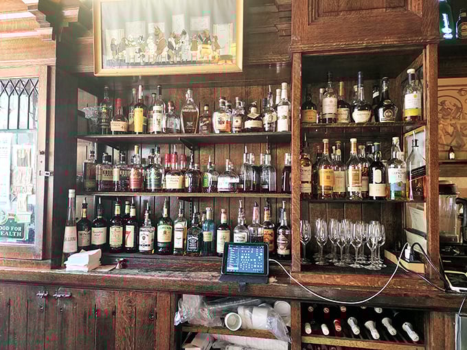 Not just a bar but a liquid museum—bottles arranged with the reverence of rare artifacts, each waiting to complement your meal perfectly.