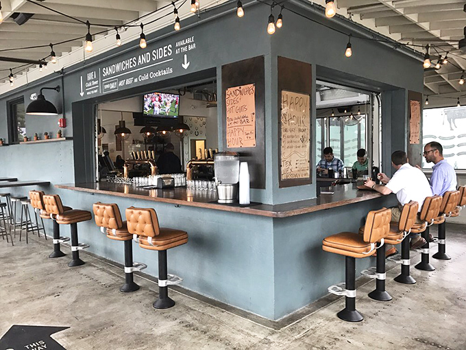 The bar area—where bourbon meets barbecue in a match made in Southern heaven. Those swivel seats have witnessed many moments of food euphoria.