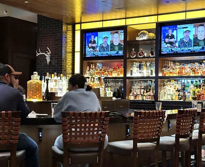The bar—where bourbon meets conversation and both get better with time. A front-row seat to liquid craftsmanship.