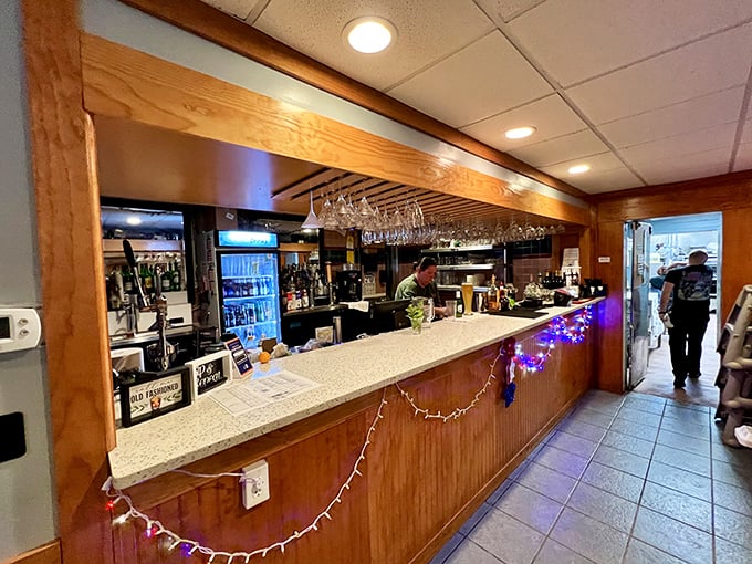 The bar at Dixie Crossroads isn't trying to be trendy—it's the kind of authentic place where bartenders remember your name and your usual order.