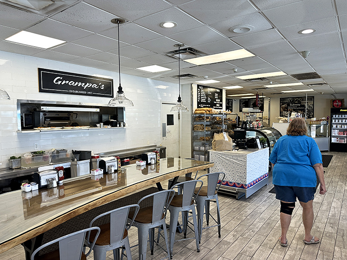 Counter seating: where solo diners become temporary food critics and the kitchen's symphony plays just feet away. The best seats for bagel-watching in the house.