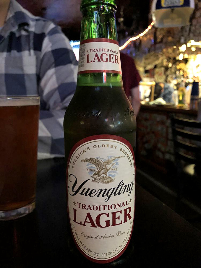 A Yuengling stands ready for duty—cooling the palate between bites of burger behemoth. The oldest American brewery meets Columbus' burger legend.