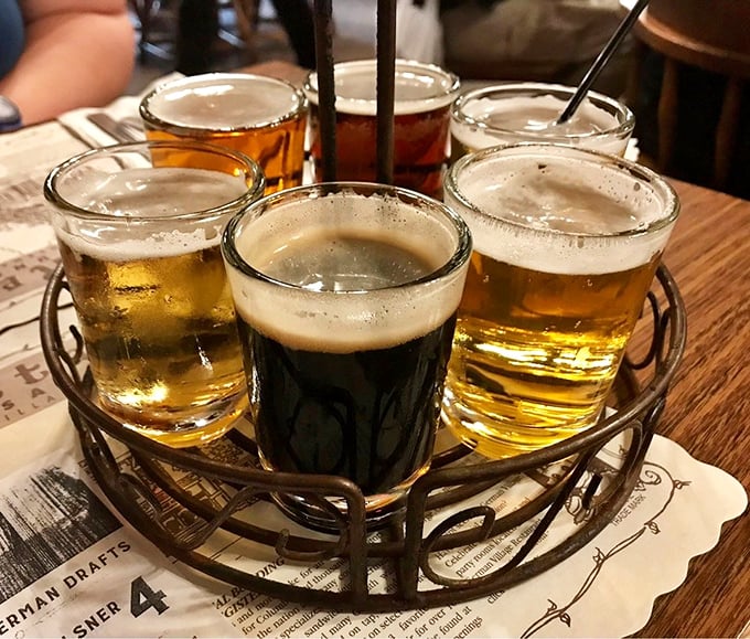 The beer sampler flight showcases German brewing excellence in one perfectly arranged wooden carrier.