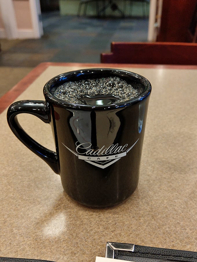 The Cadillac Café mug – holding liquid motivation that's fueled countless Portland mornings and brilliant conversations.