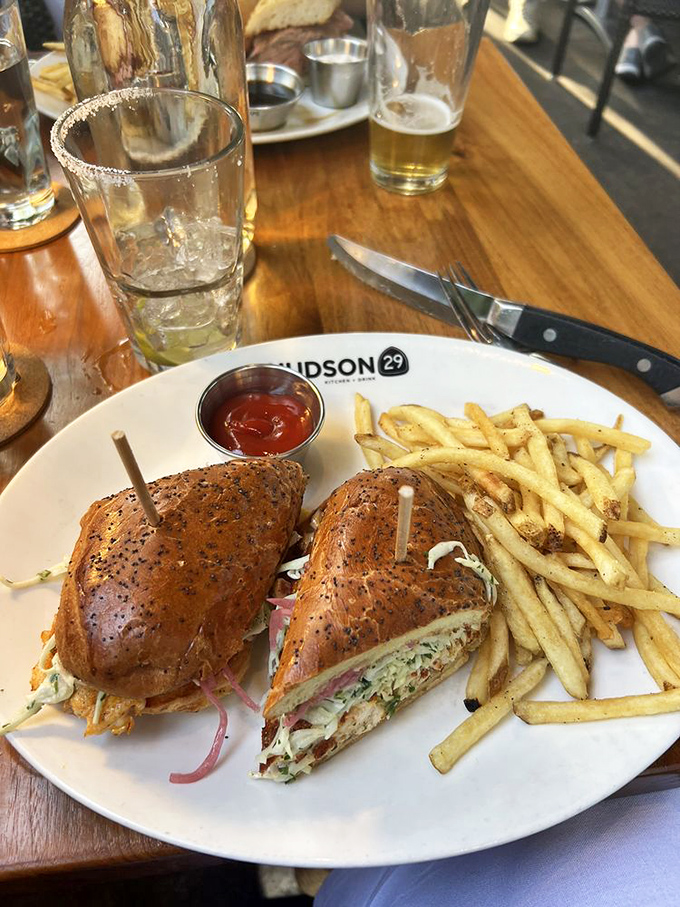 A sandwich that requires both hands and several napkins—the hallmark of something truly worth eating. Fries so perfect they deserve their own fan club.