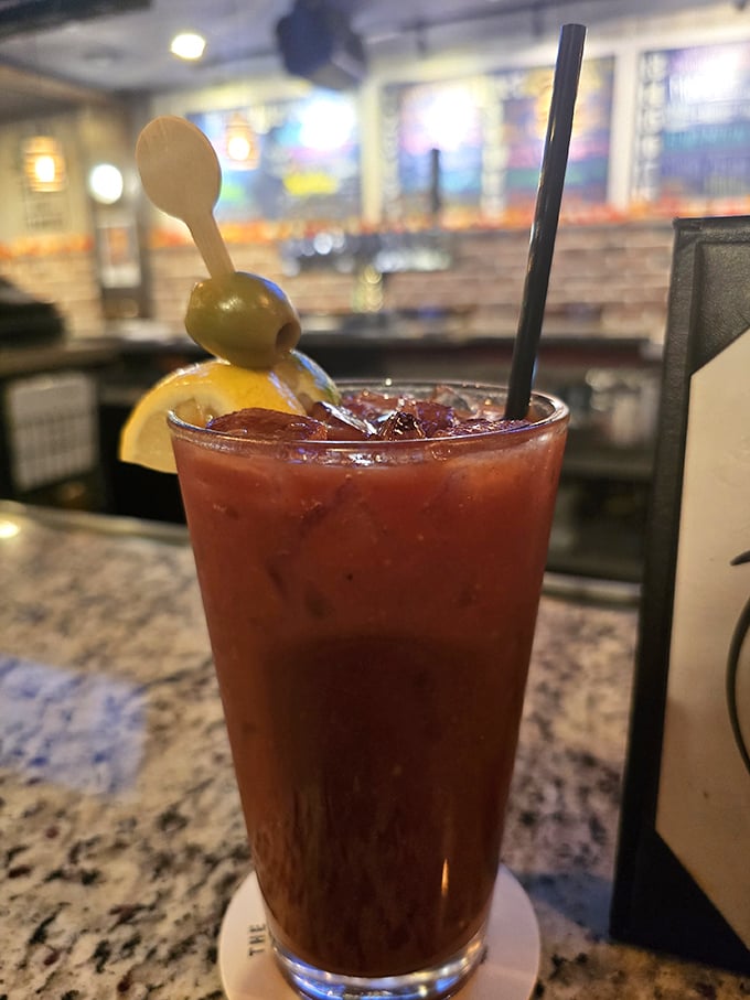 The Bloody Mary arrives with olives standing at attention. This isn't just a cocktail—it's a liquid brunch with attitude and the perfect weekend salute.