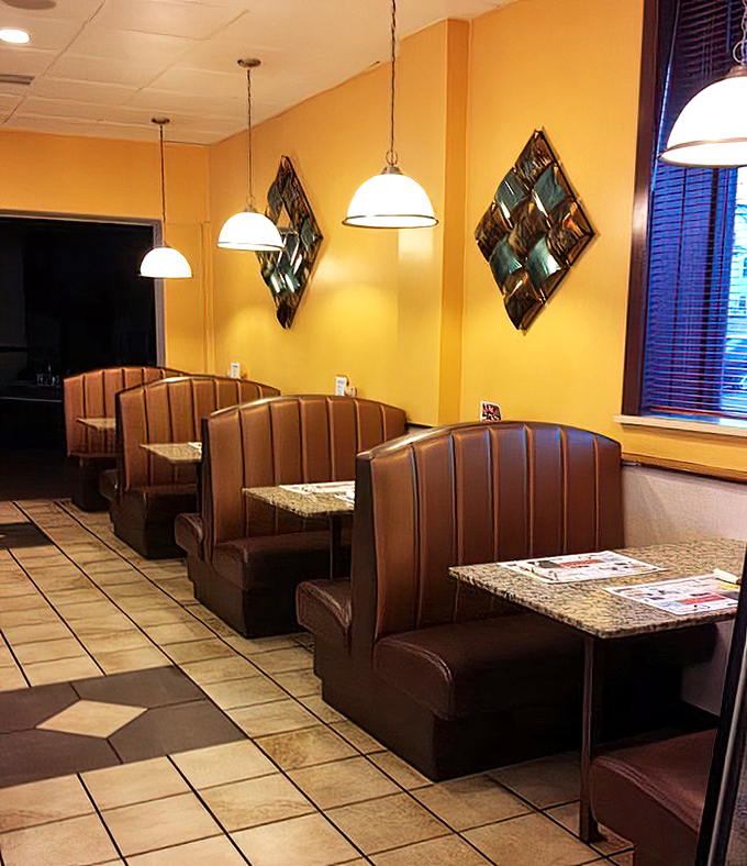 Those brown vinyl booths aren't just seating – they're front-row tickets to the greatest show on earth: breakfast at a classic American diner.