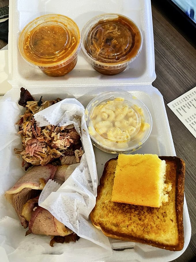 BBQ to-go means the party continues at home. That cornbread square isn't just a side—it's the golden ticket to happiness.