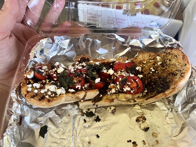 The bruschetta arrives like edible jewelry—tomatoes, feta, and herbs creating a symphony of flavors on perfectly toasted bread.
