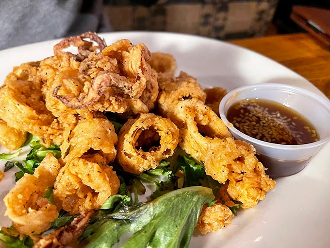 Calamari that breaks the rubbery ring stereotype – crisp, tender, and practically begging for a quick dip in that house-made sauce.