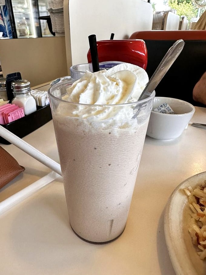 A milkshake thick enough to require serious straw negotiation skills and patience—a virtue rarely needed in our instant-gratification world.