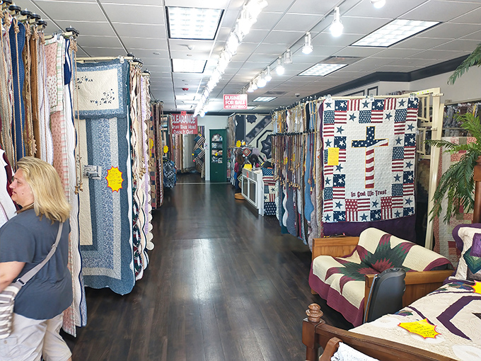 A quilt lover's dream corridor, where patriotic patterns and handcrafted treasures tell stories in fabric. Grandma would definitely approve.