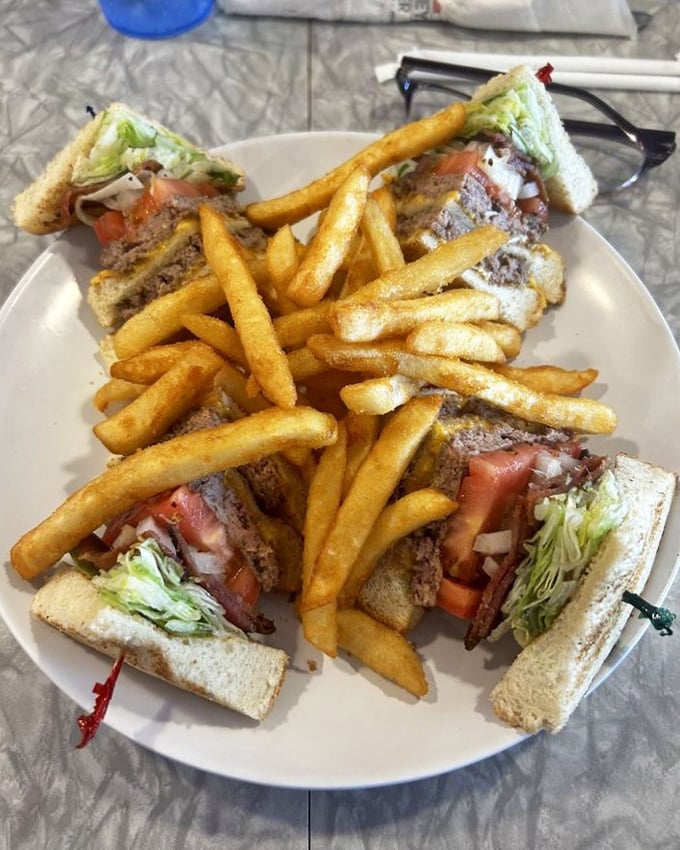 The club sandwich—civilization's greatest contribution to lunch. Stacked high with layers that create the perfect bite every time.