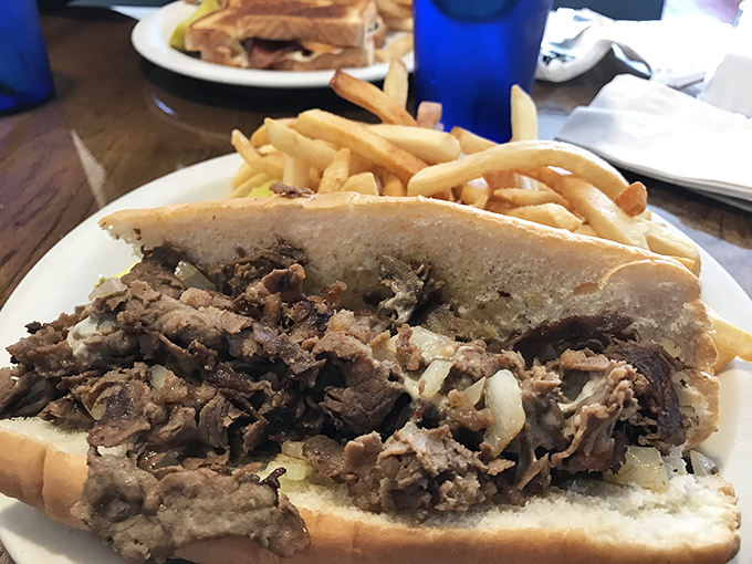 The holy grail of Pennsylvania sandwiches: thinly sliced beef, caramelized onions, and fries that refuse to be mere sidekicks.