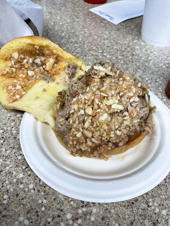 The open-faced declaration of devotion—chopped pork finding its soulmate in a simple bun.