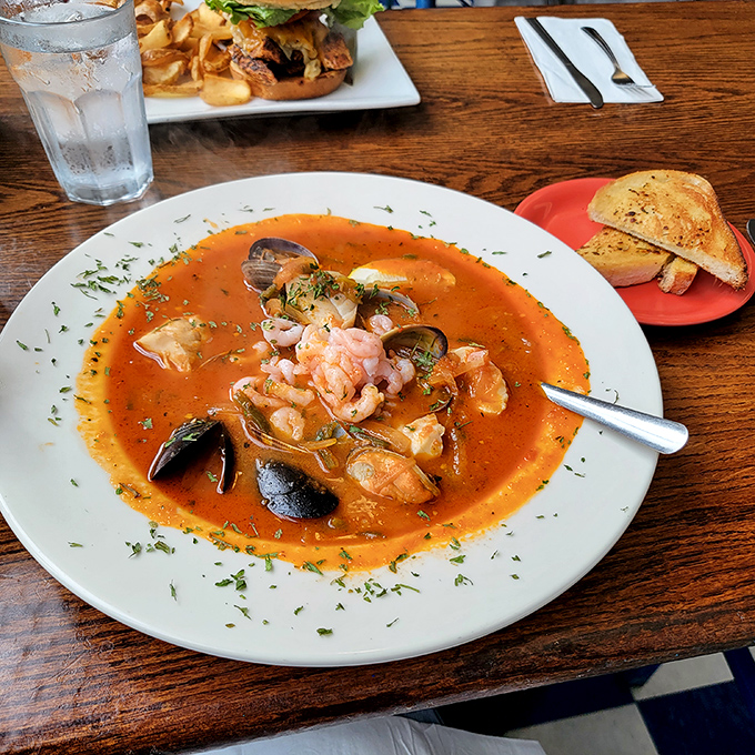 This seafood stew is like a United Nations summit of the sea—shrimp, mussels, and fish negotiating a delicious peace treaty in tomato broth.