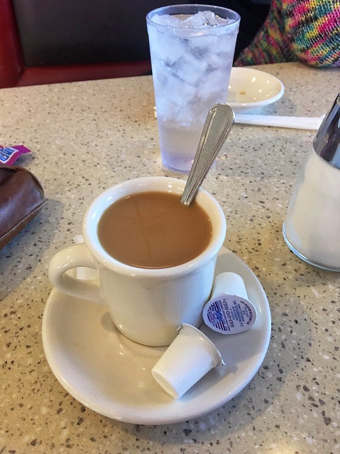 That classic white mug of diner coffee—not fancy, not pretentious, just reliably there when you need it most.