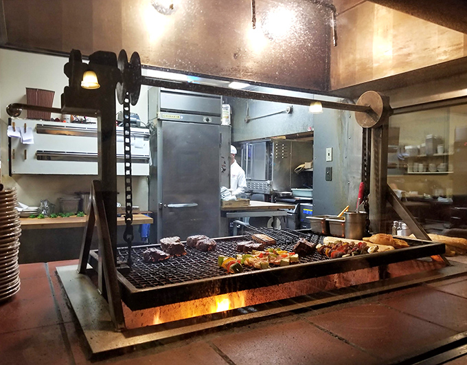 This isn't just a grill—it's the altar where ordinary meat transforms into extraordinary memories, all by the grace of oak fire.