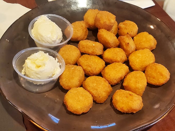 Golden corn nuggets with dipping sauces—proof that Wisconsin knows comfort food isn't just a category, it's an art form worth mastering.