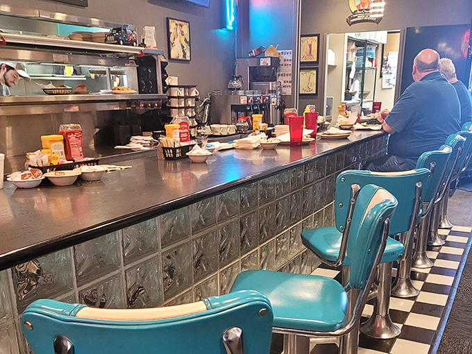 The counter seats aren't just the best show in town—they're front-row tickets to the symphony of short-order cooking and local gossip.