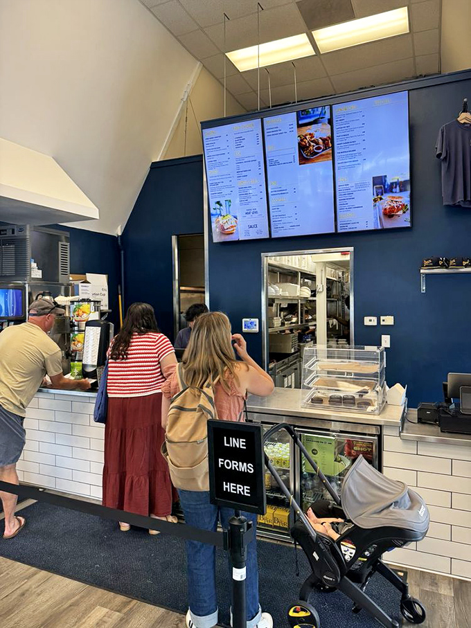 The ordering counter—that magical threshold where hungry hope transforms into the promise of imminent satisfaction. The line forms for good reason.