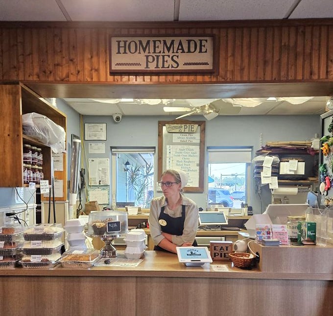 Behind this counter, pie dreams come true. The sign above says "Homemade Pies" but might as well read "Happiness Served Daily."