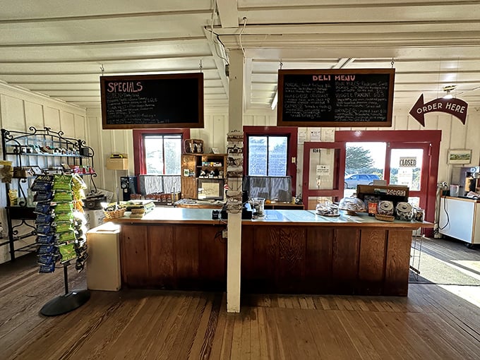 The deli counter serves as command central, where skilled hands craft sandwiches with the care of true culinary artisans. 