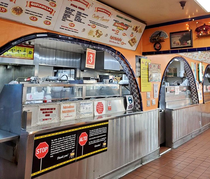 The ordering counter—where dreams are ordered, assembled with practiced efficiency, and handed over on humble paper plates.