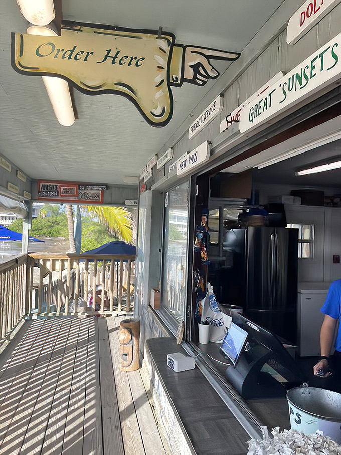 Old-school ordering at its finest. That hand-painted sign has directed more hungry souls to happiness than most self-help books.