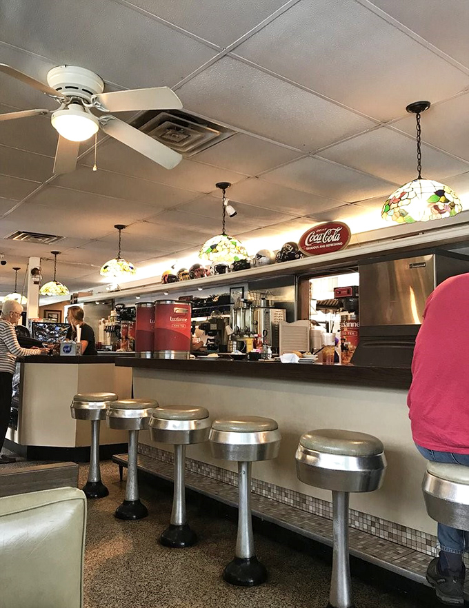 Classic counter seating where regulars have probably claimed their spots for years. Some of life's best conversations happen on these stools.