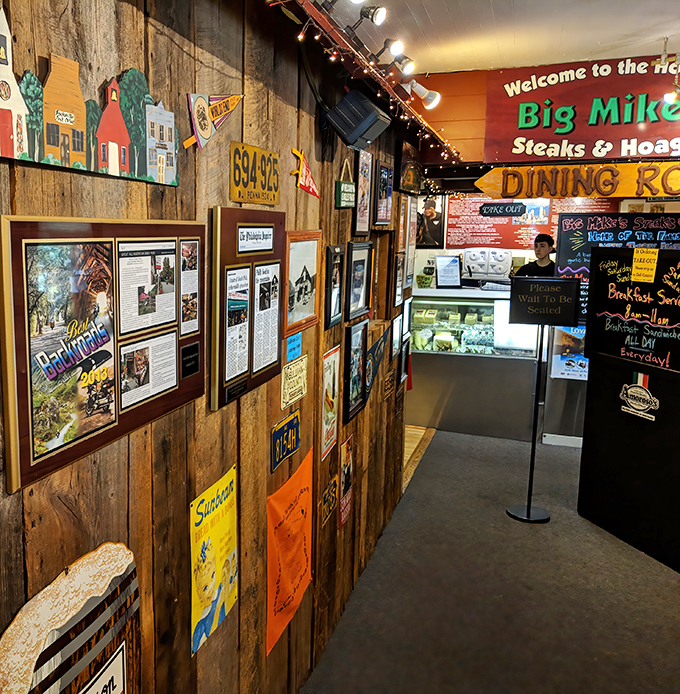 The walls tell stories of adventures past—newspaper clippings and local memorabilia create a museum of mountain memories alongside Philly pride. 