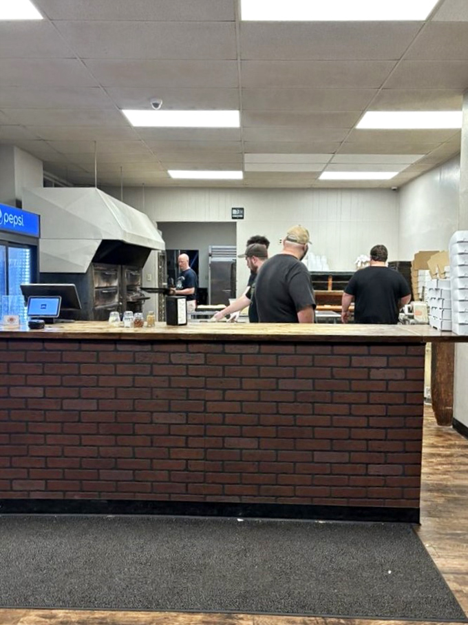Behind this counter, pizza dreams become delicious reality through old-school craftsmanship and genuine care.