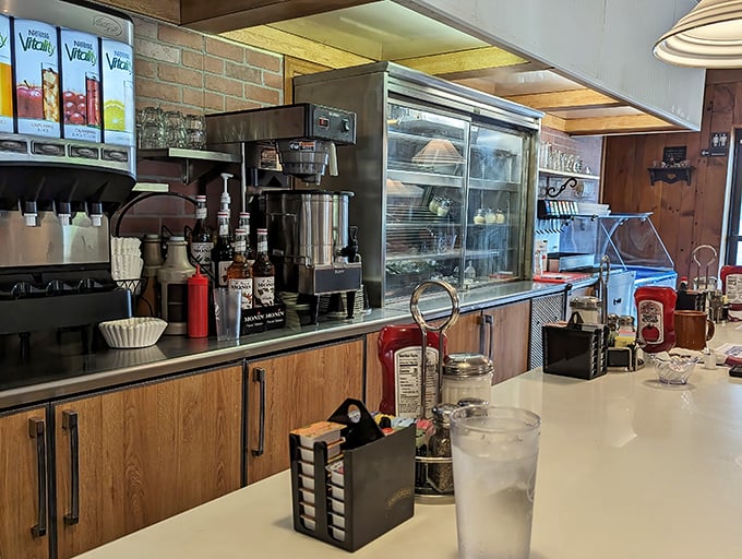 The counter seats – where solo diners become regulars and servers remember exactly how you like your coffee after just one visit.