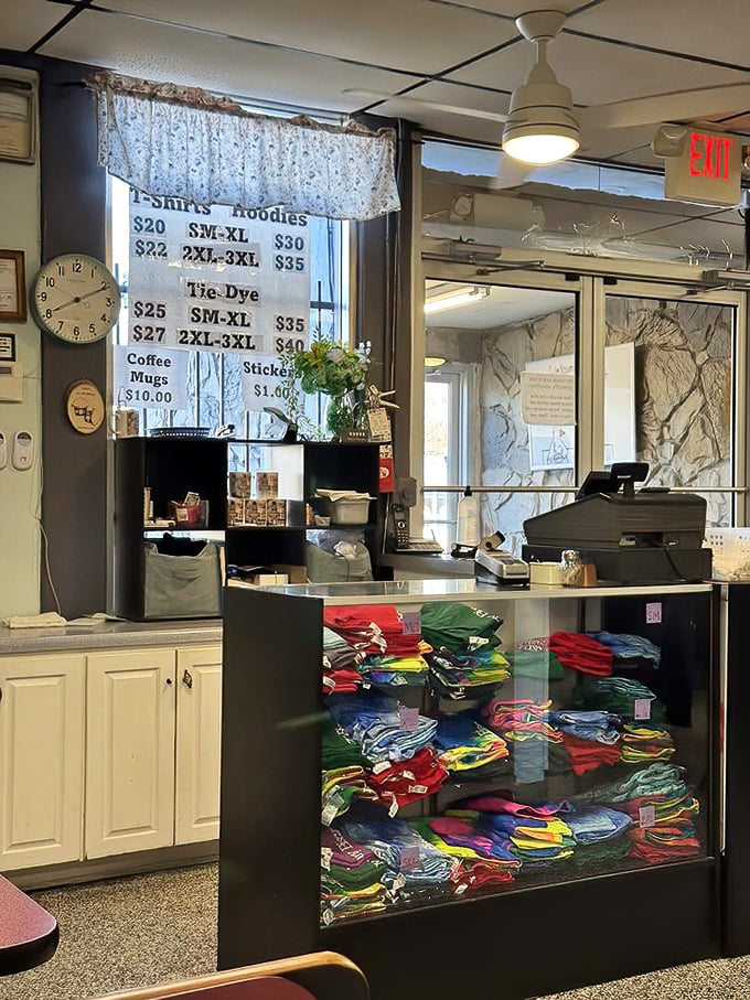 At the counter, colorful merchandise shares space with the cash register - proof that the best local spots become community landmarks.