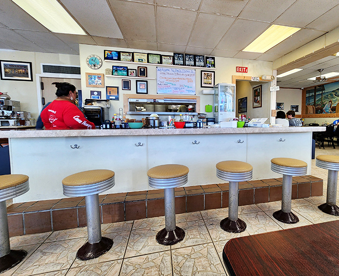 Classic diner counter seating—where solo diners become part of the community. These stools have heard more Florida Keys stories than any bestselling memoir.