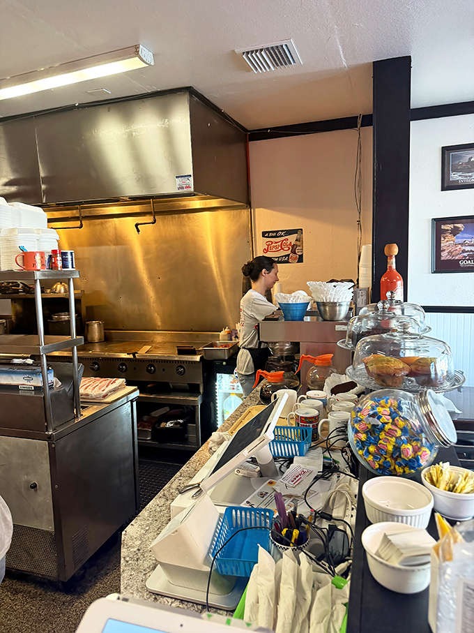 The counter—where solo diners find community and everyone gets a front-row seat to the breakfast ballet happening in the kitchen.