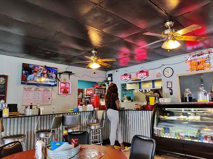 The counter area showcases classic diner charm where every detail contributes to the authentic comfort food experience.